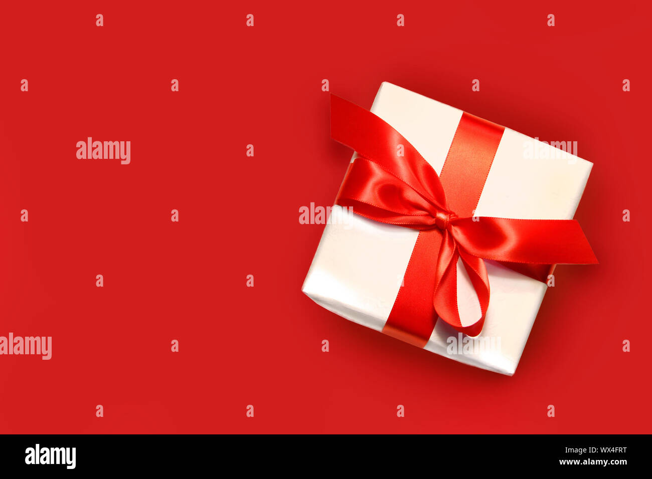 Little red gift isolated on white background Stock Photo - Alamy
