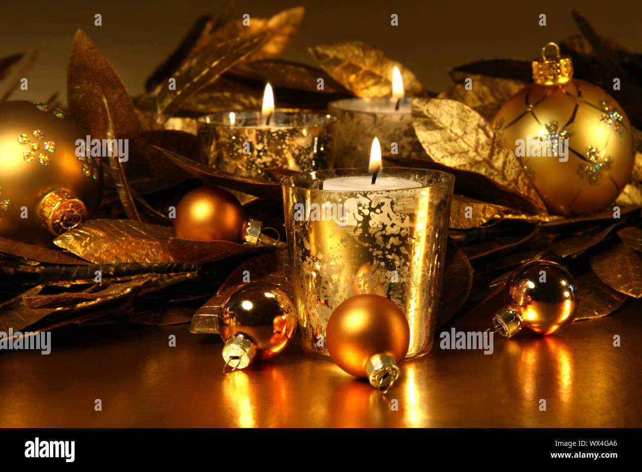 Candles light with a sparkling gold theme Stock Photo - Alamy