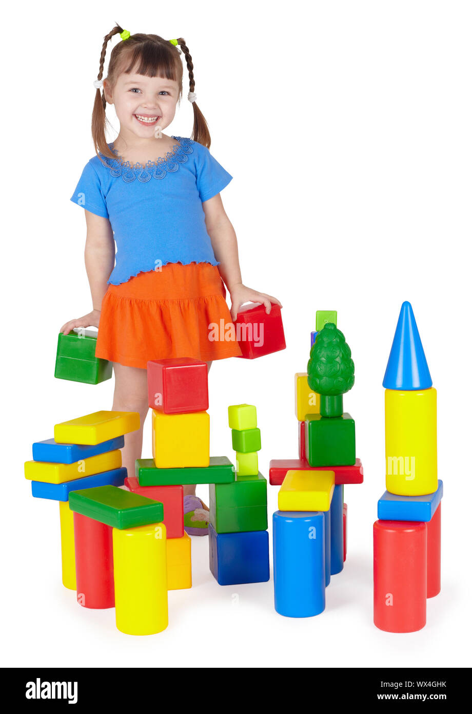Child happily playing with colored blocks on white Stock Photo - Alamy