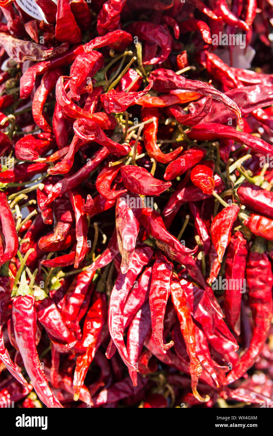Dried red chilli paprika on a market stall Stock Photo - Alamy