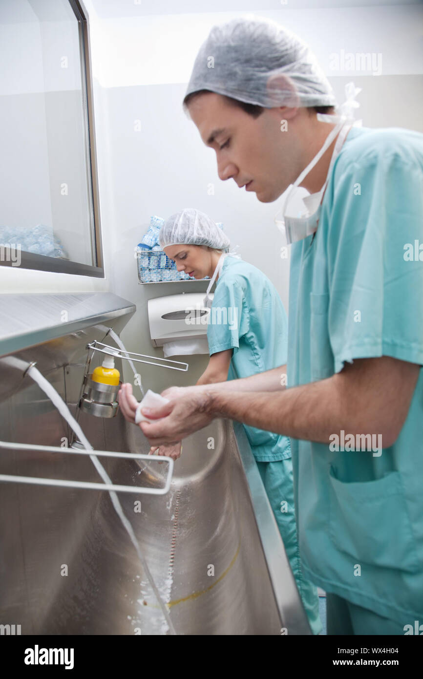 Doctors washing hands after operation Stock Photo - Alamy