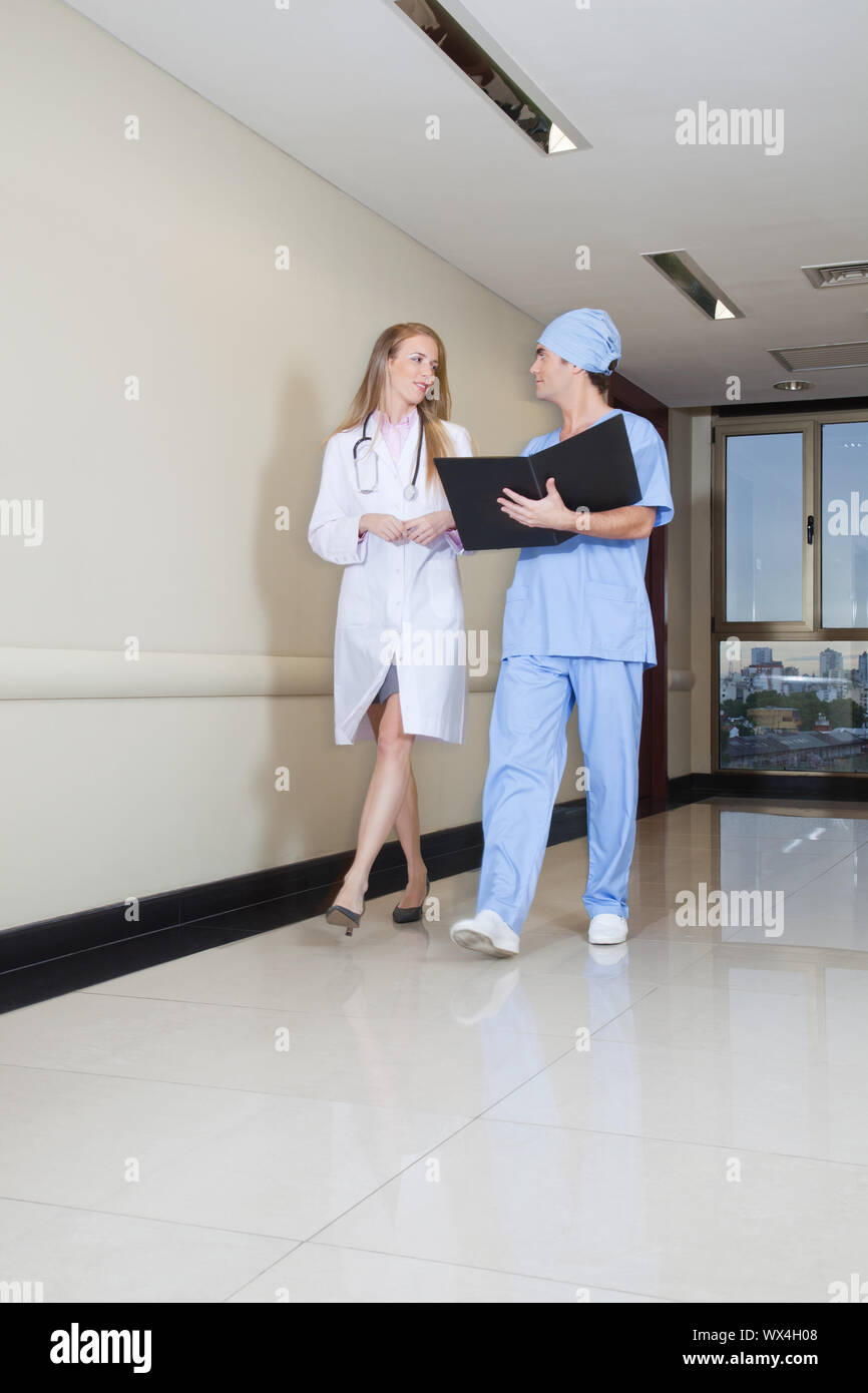 Doctor and nurse reading information Stock Photo - Alamy