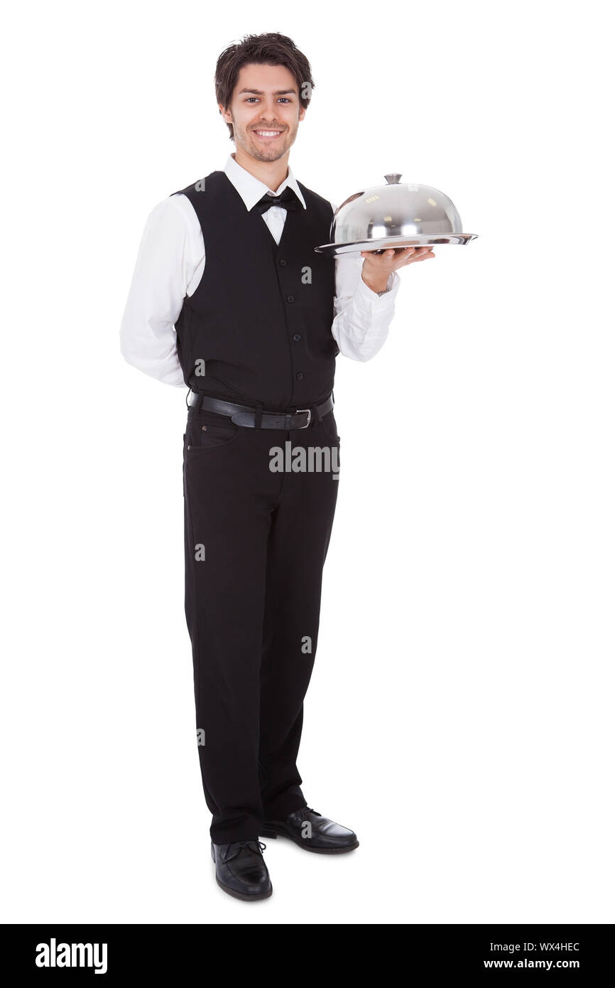 Portrait of a butler with bow tie and tray. Isolated on white Stock ...