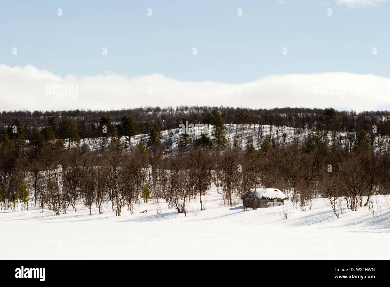 A cabin on a snow filled landscape Stock Photo - Alamy