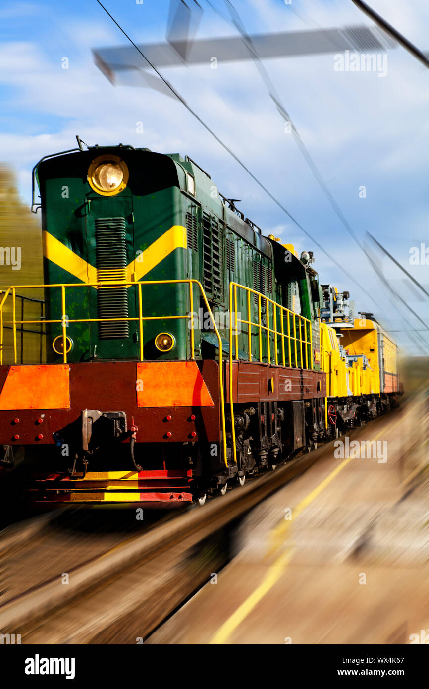 Fast moving old fashioned train in the summer Stock Photo - Alamy