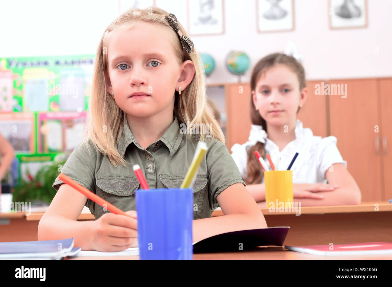 School children with school clothes at school desks hi-res stock ...
