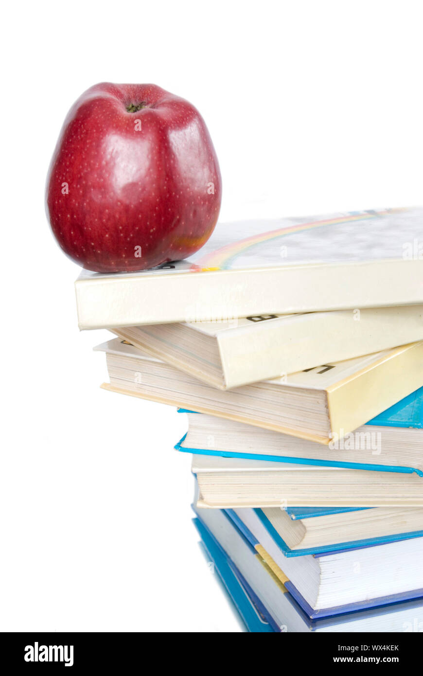 Red apple and stack of books for school Stock Photo - Alamy
