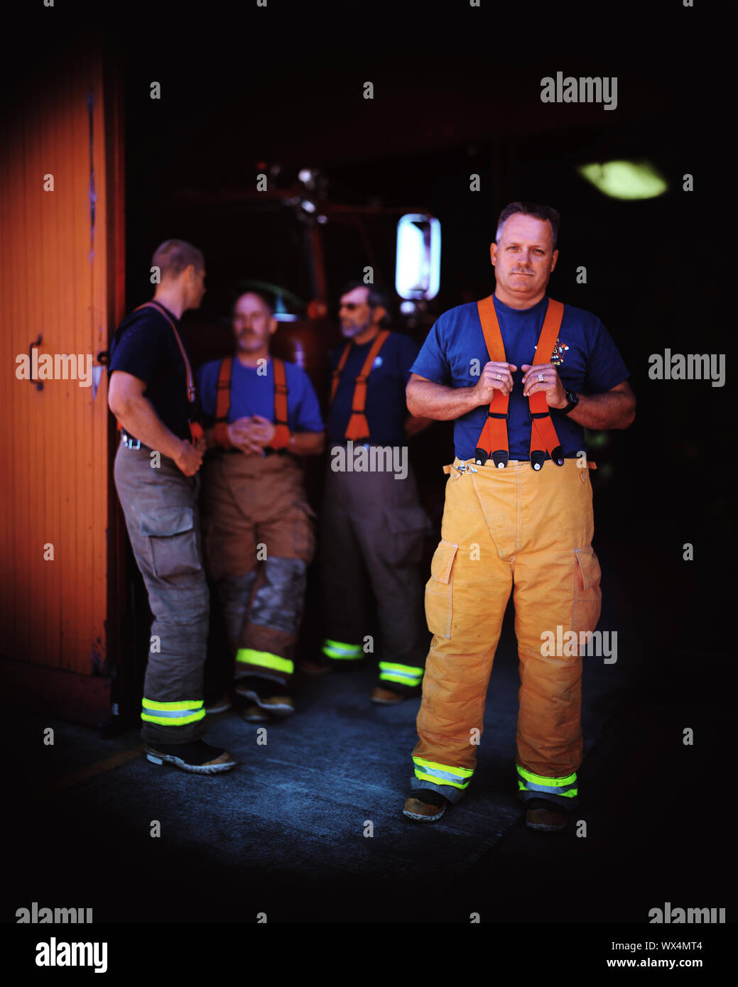 A fireman looking at the camera Stock Photo - Alamy