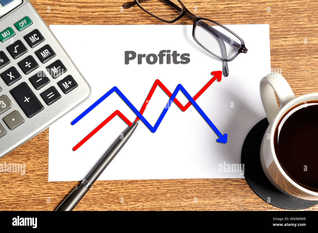 Note graph of profit on table businessman Stock Photo - Alamy