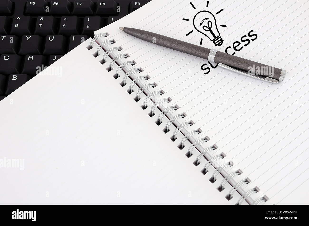 notebook, diary and pen success concept Stock Photo - Alamy