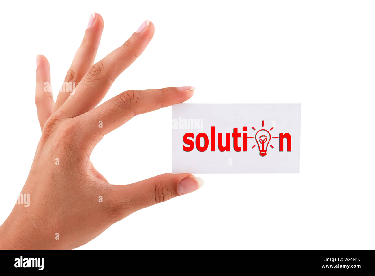 solution symbol on card in hand Stock Photo - Alamy