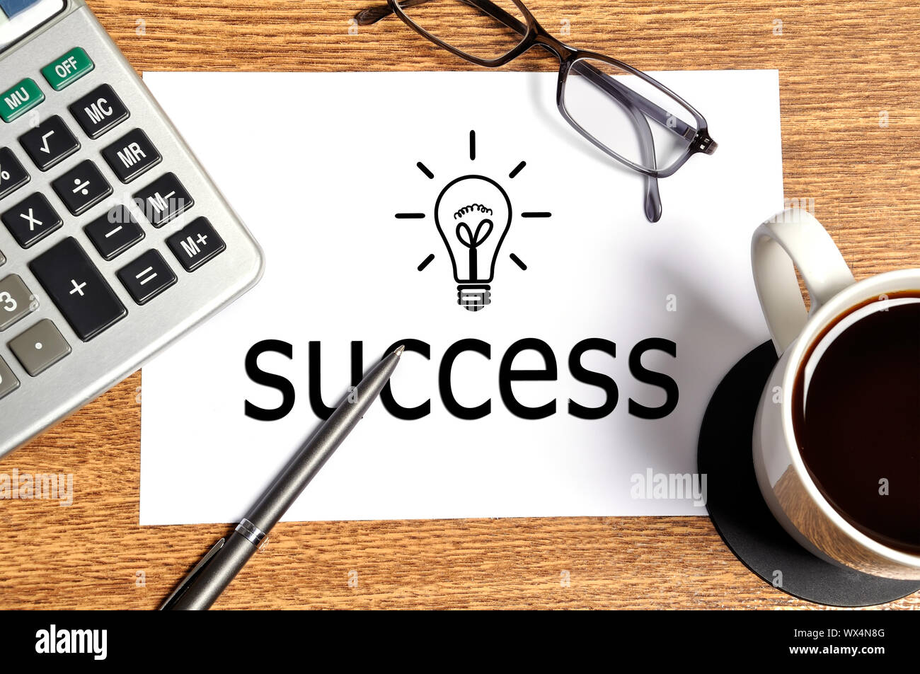 Note success on table businessman Stock Photo - Alamy