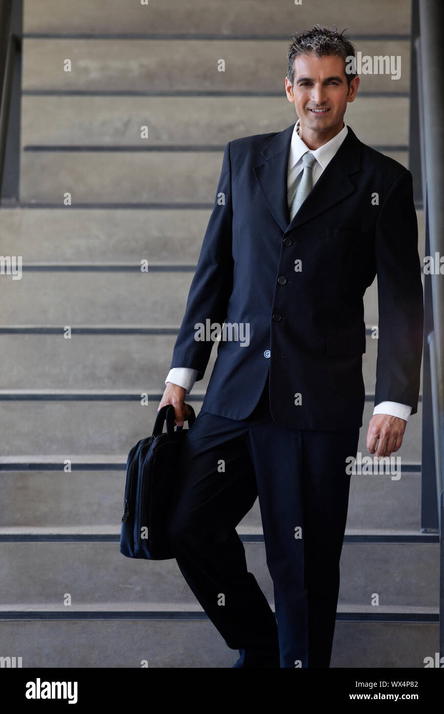 Smart man walking down steps hi-res stock photography and images - Alamy