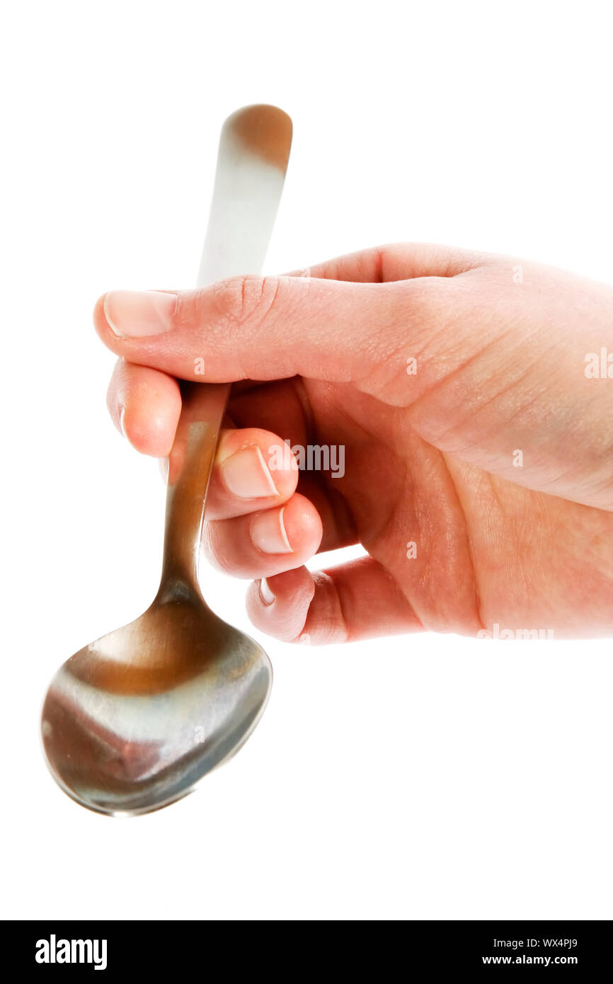 Spoon in Hand Stock Photo - Alamy