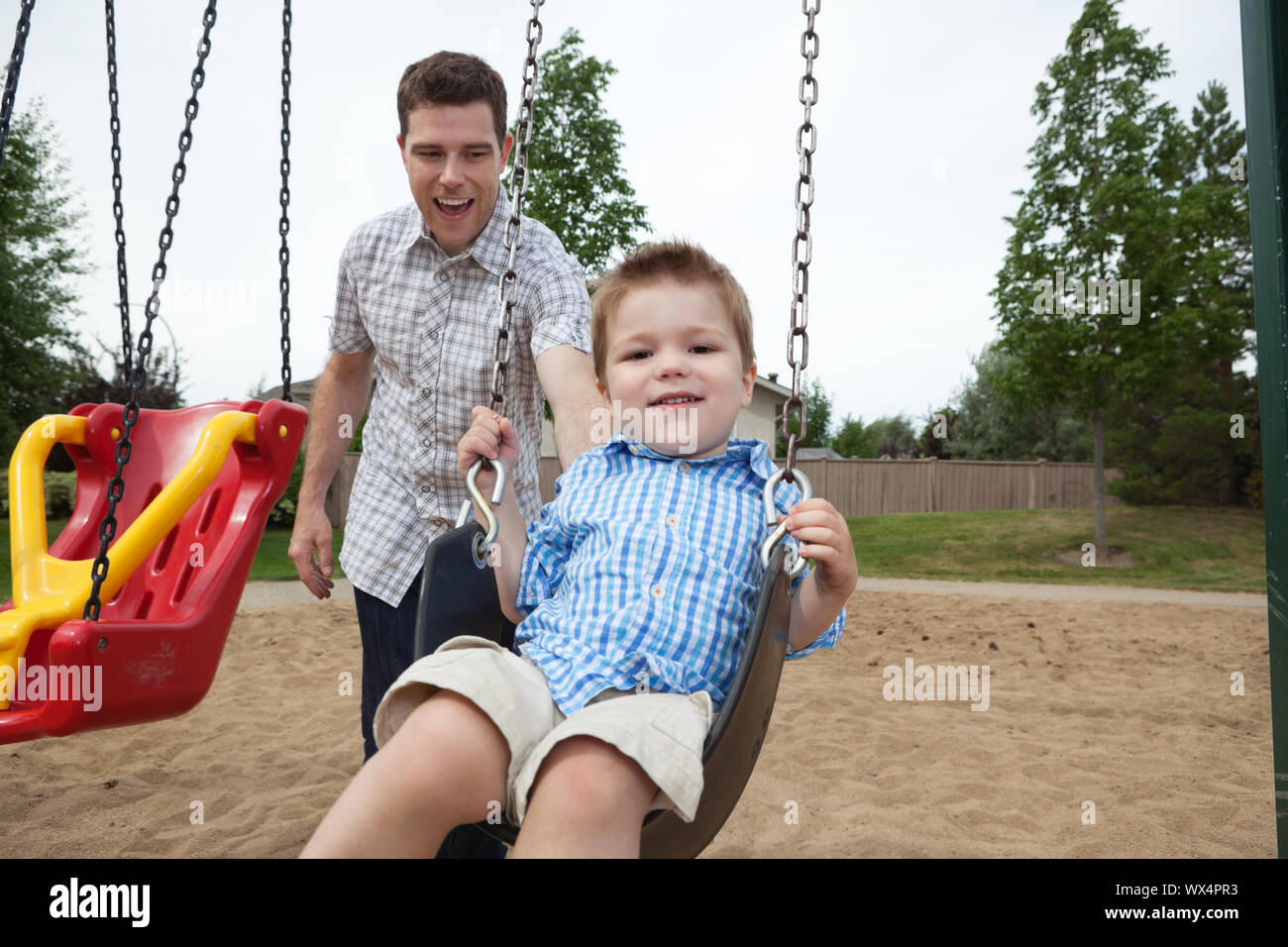 Father and Son in Playground Stock Photo - Alamy