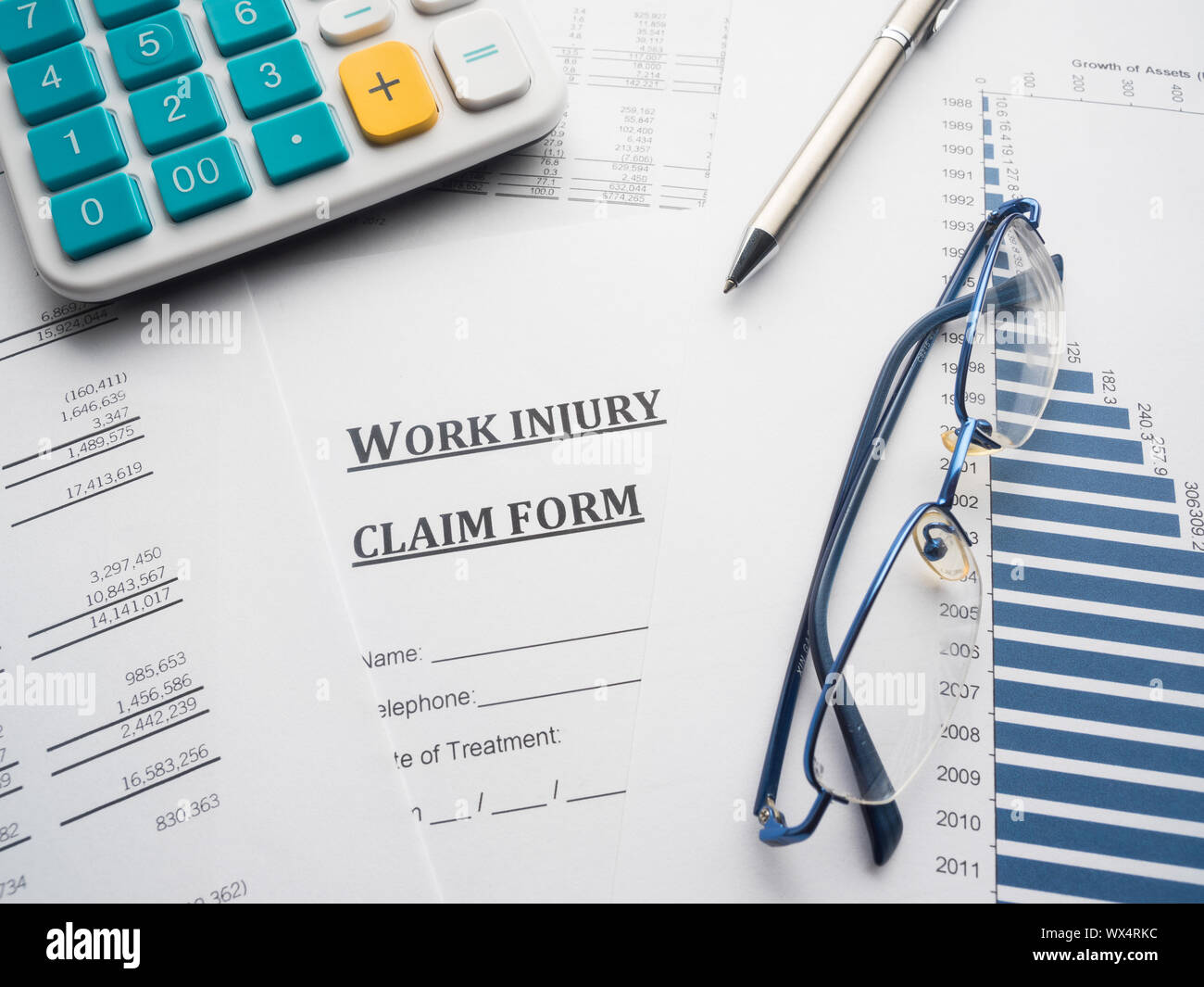 work injury claim form on desk Stock Photo - Alamy