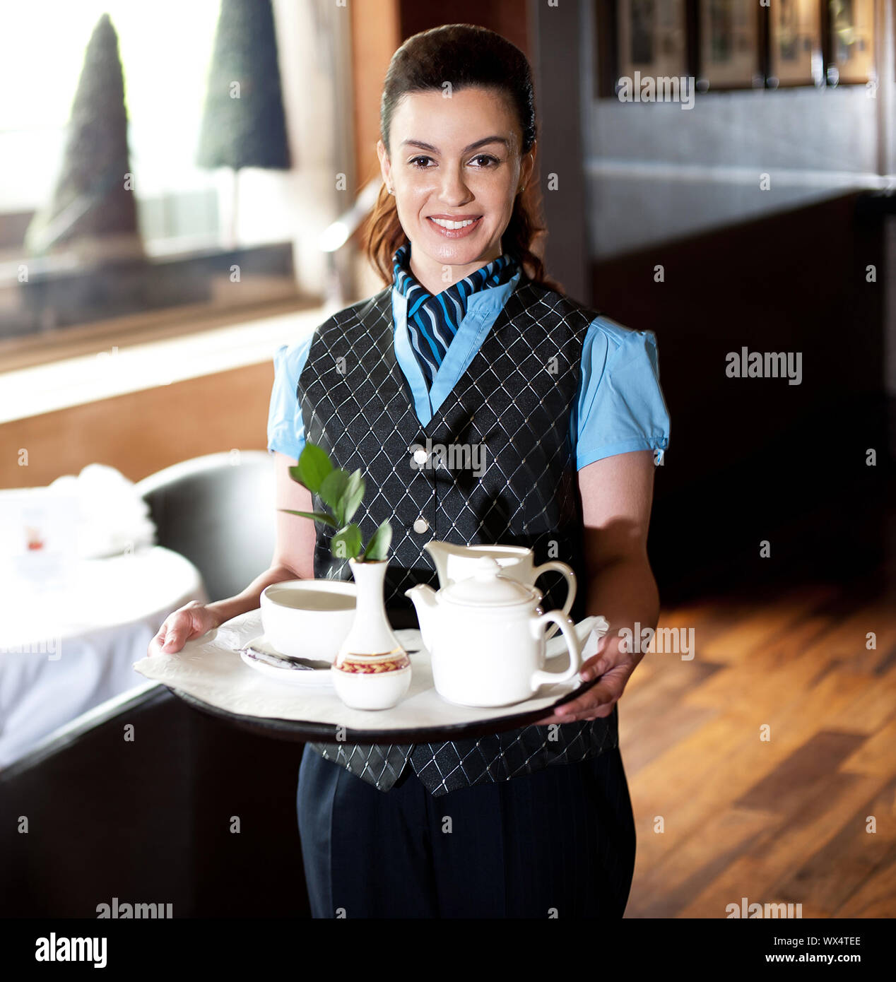 Pretty waitress posing with tea for guests in the restaurant Stock ...