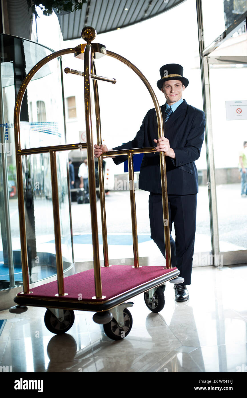 Hotel doorman and reception and lobby hi-res stock photography and ...