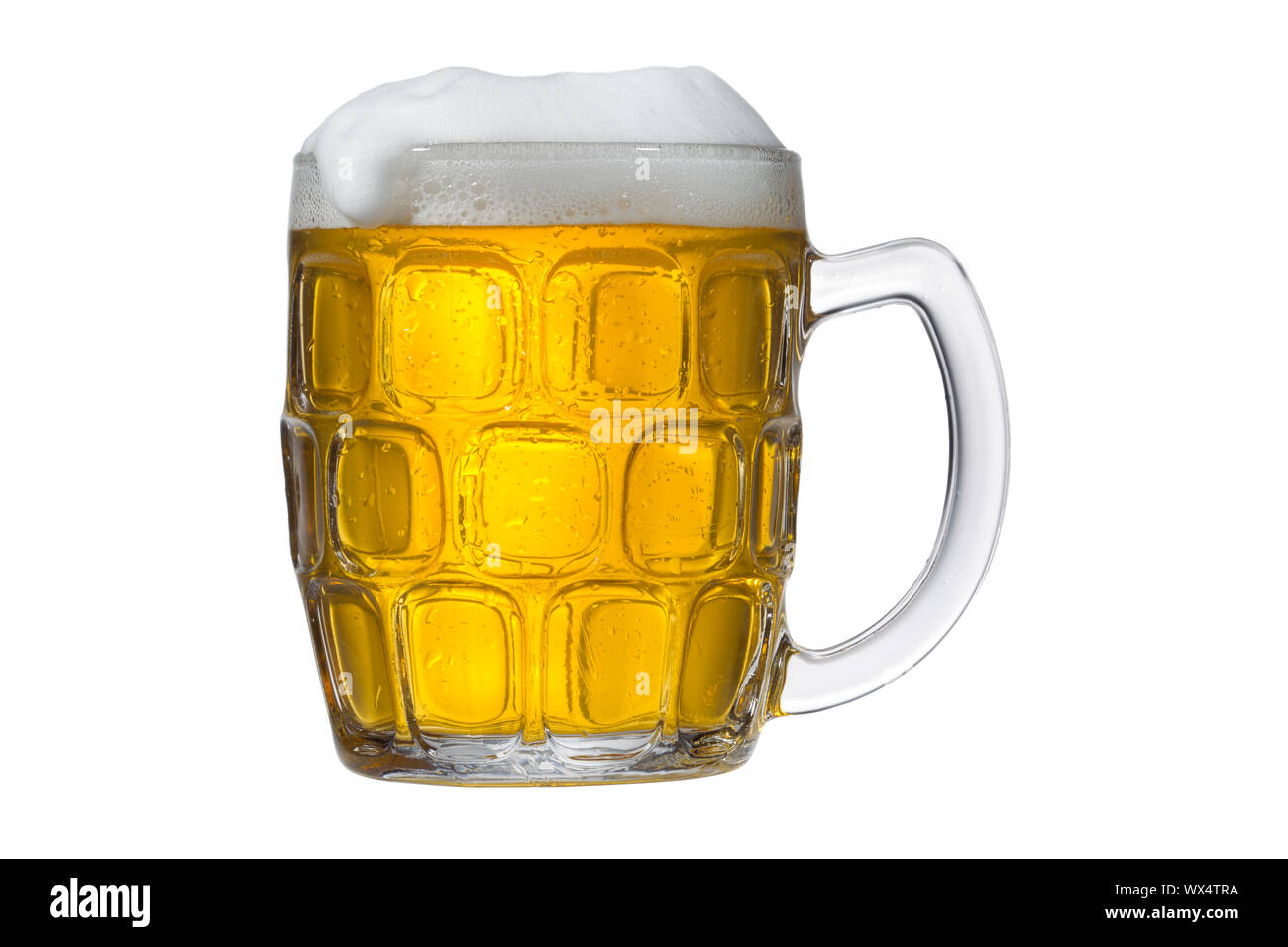 Detailed shot of a beer mug filled with beer against white background ...