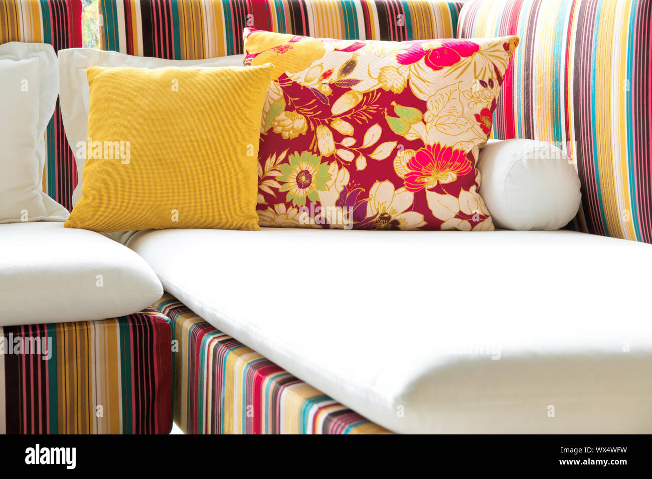 Colorful cushions in sofa Stock Photo - Alamy