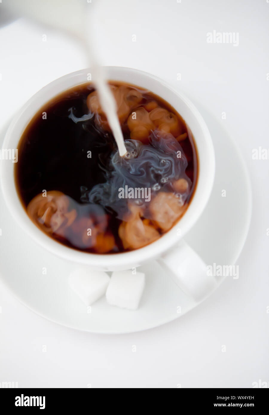 Milk and coffee against a white background Stock Photo - Alamy