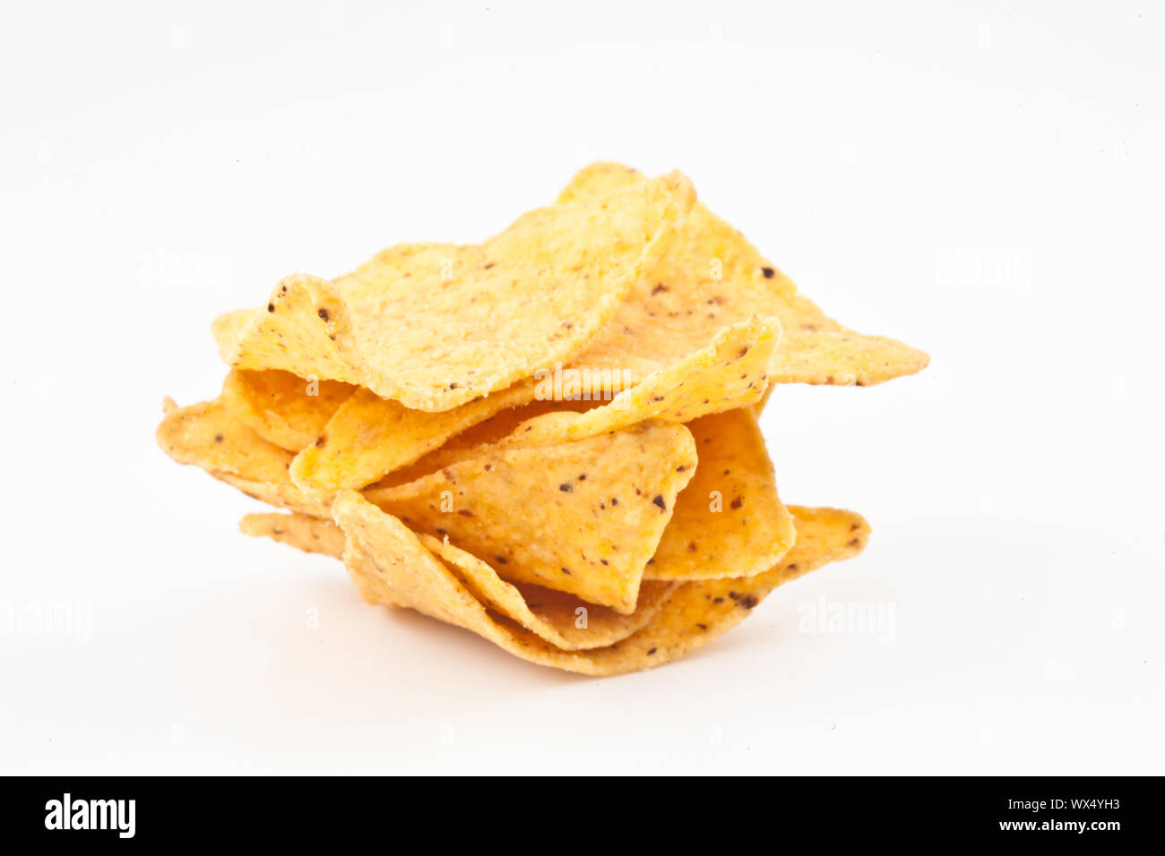 Little stack of crisps against white background Stock Photo - Alamy