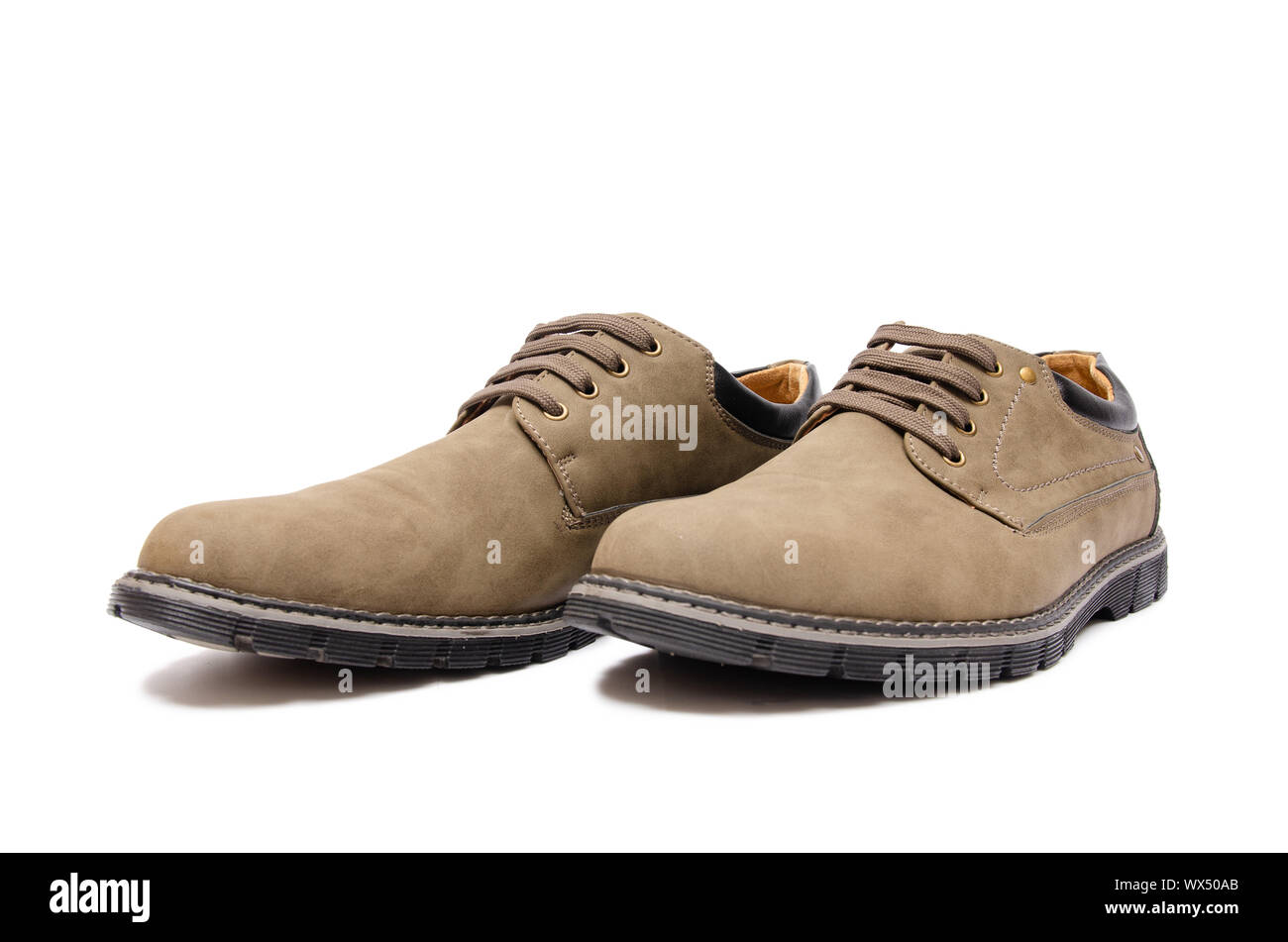 Brown suade shoes isolated on white background Stock Photo - Alamy