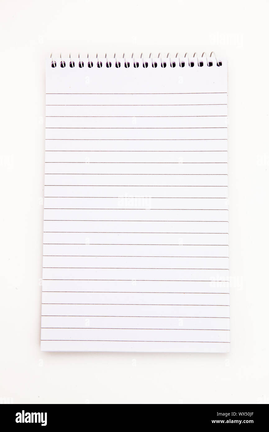 Empty notepad sheet against white background Stock Photo - Alamy