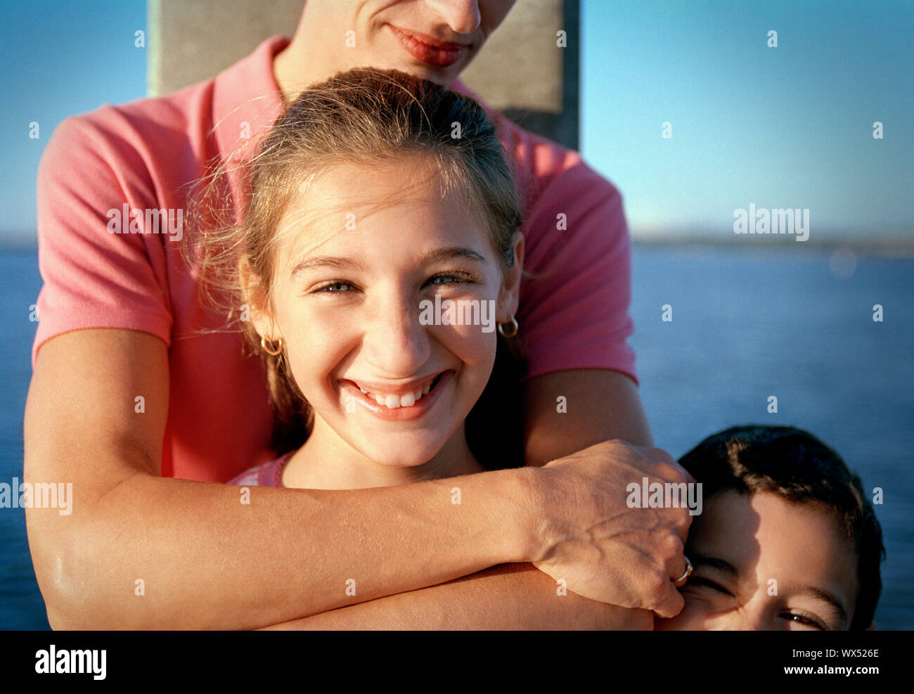 Mum child embrace behind hi-res stock photography and images - Alamy