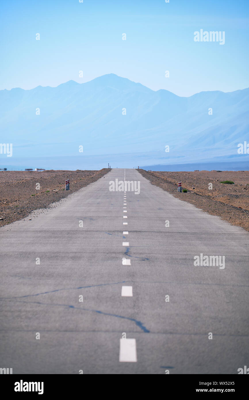 Empty asphalt straight highway road in Mongolia between mongolian towns ...