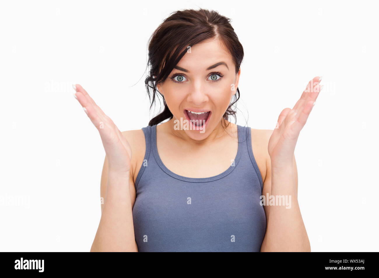 Happily surprised student against white background Stock Photo - Alamy