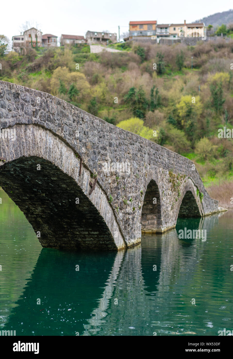 Ancient stone arch bridge in Rijeka Crnojevica Stock Photo - Alamy