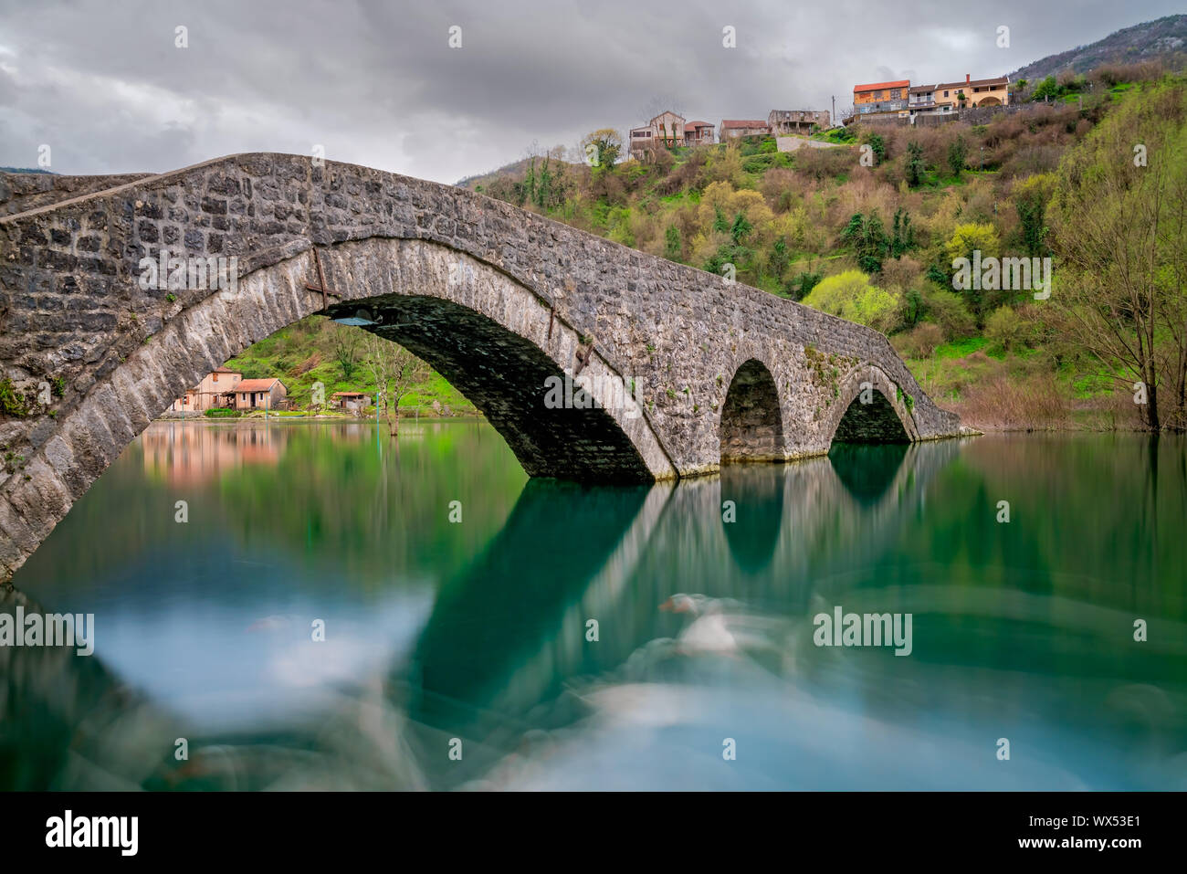 Ancient stone arch bridge in Rijeka Crnojevica Stock Photo - Alamy