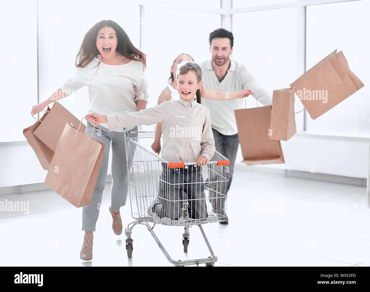 fun family with shopping bags and shopping cart.photo with copy space ...