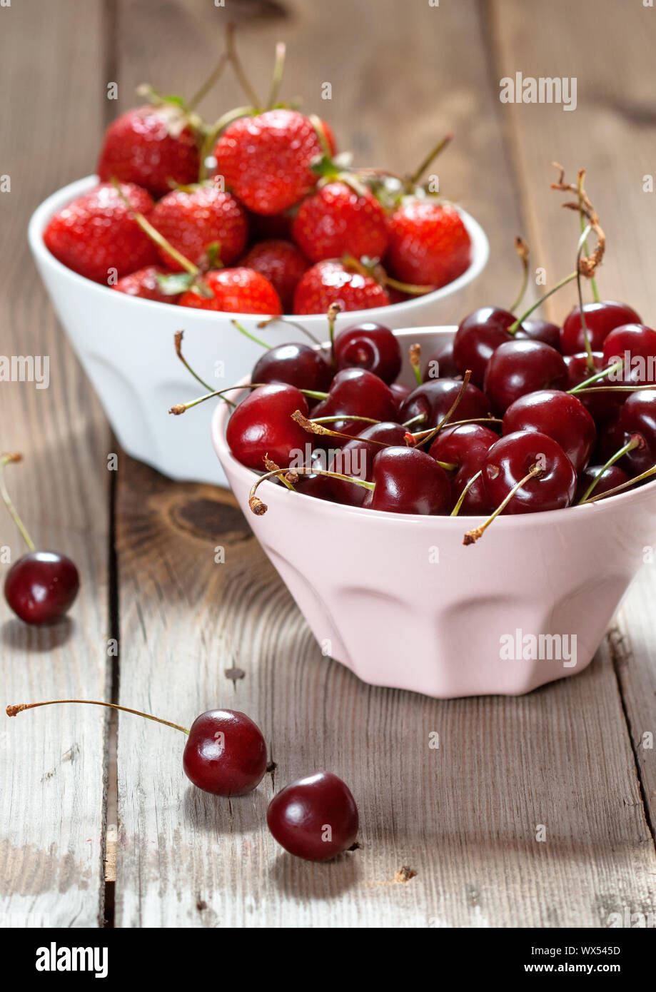 Sweet cherries and strawberry Stock Photo - Alamy