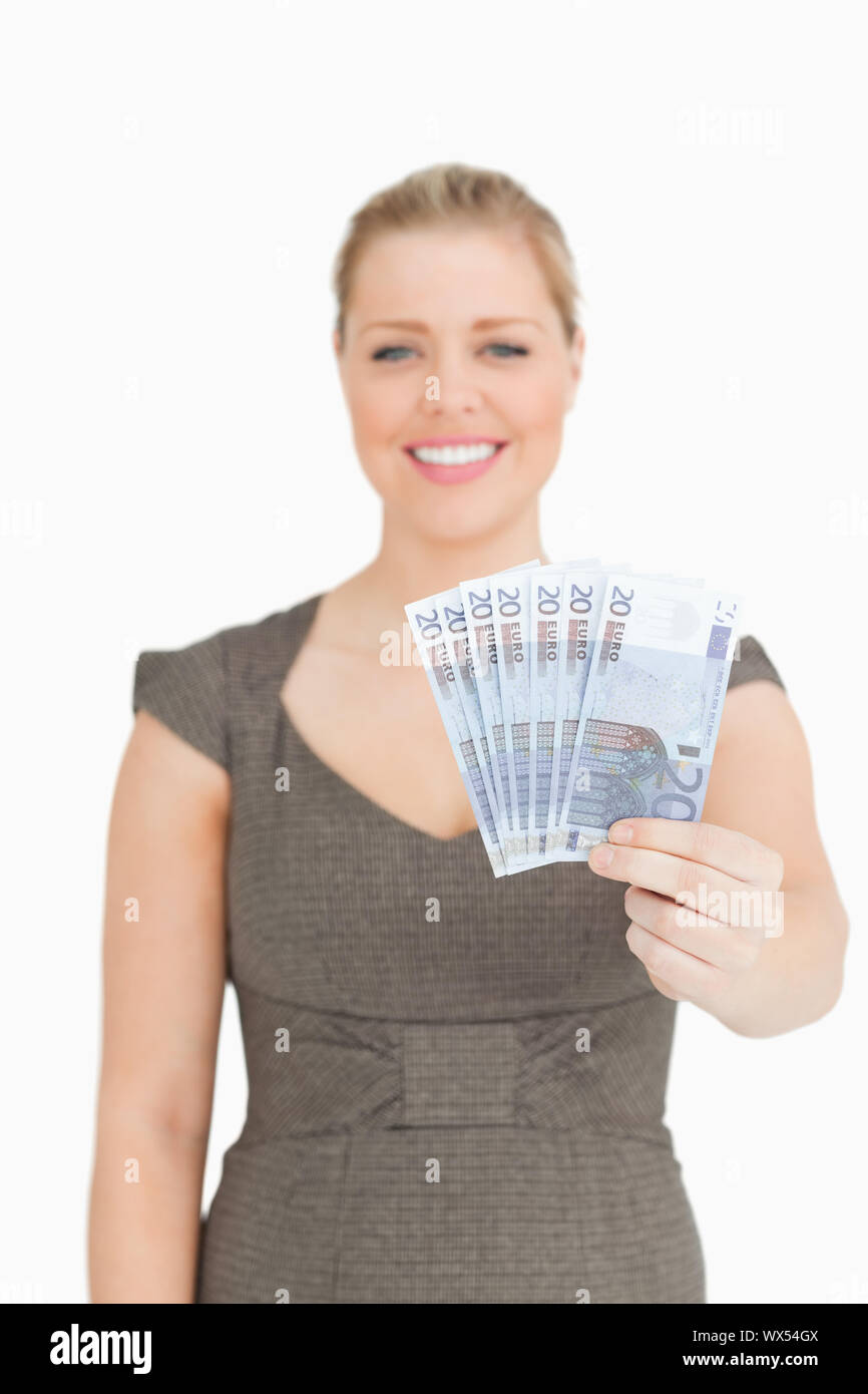 Woman showing her euro banknotes against white background Stock Photo ...