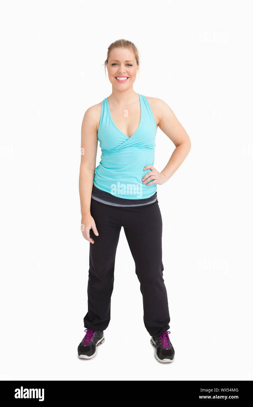 Woman with a hand on her hip against white background Stock Photo - Alamy