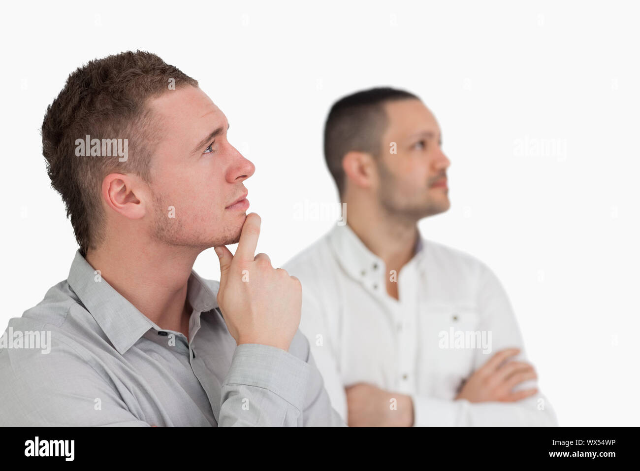 Thinking men against a white background Stock Photo - Alamy