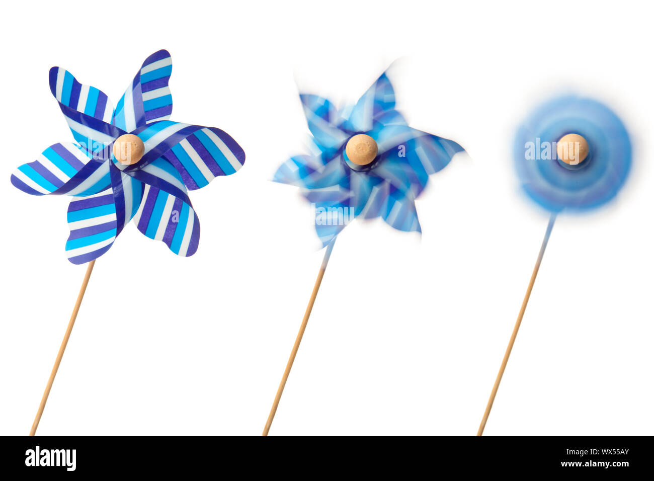 Three blue pinwheels against a white background Stock Photo - Alamy