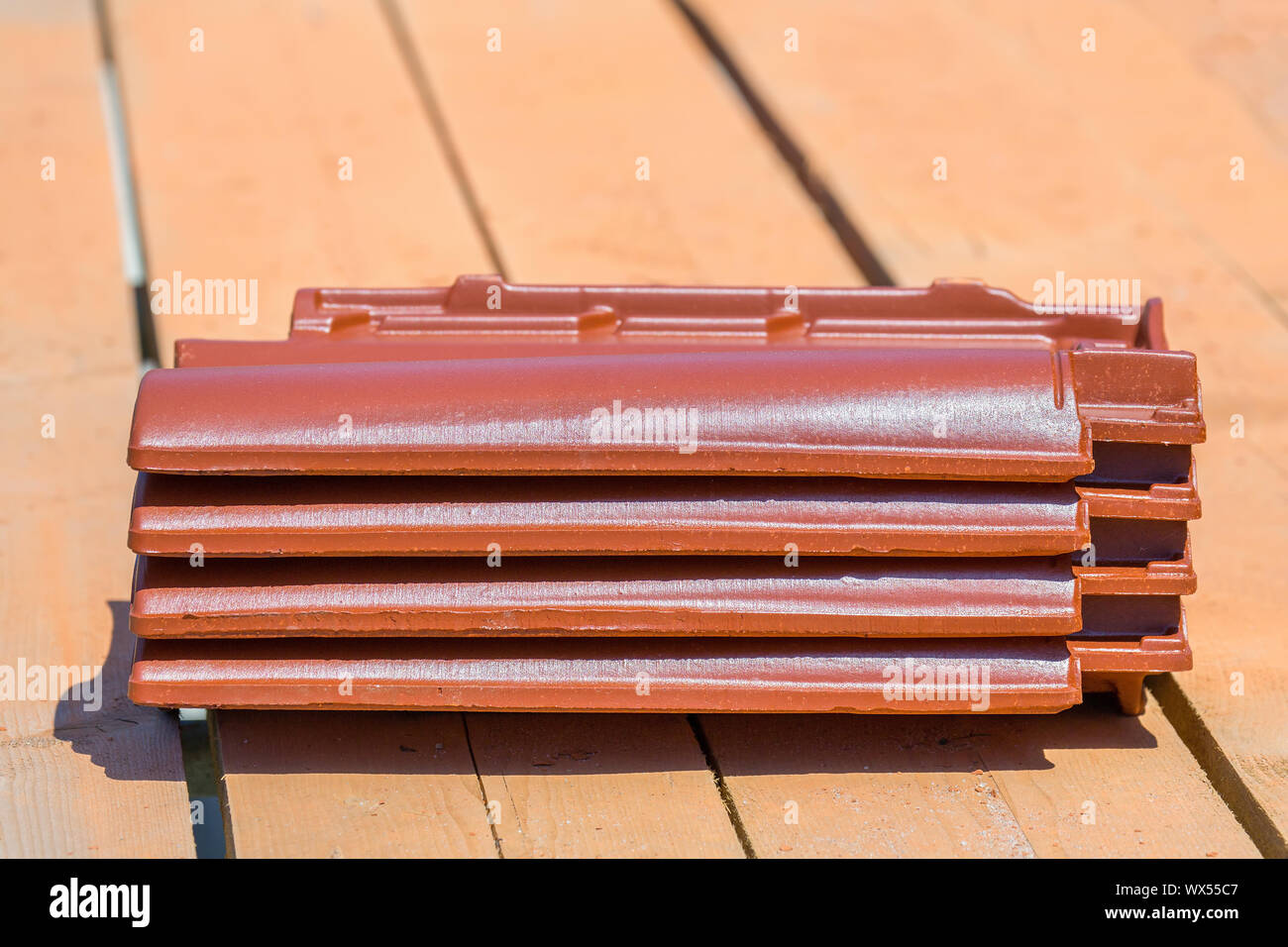 Stack of new roof tiles lying on scaffold boards Stock Photo - Alamy