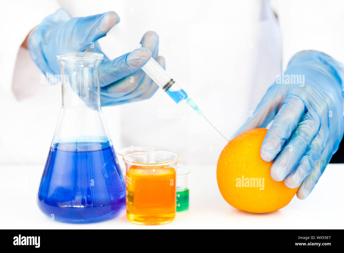 Injecting a liquid into an orange hi-res stock photography and images ...
