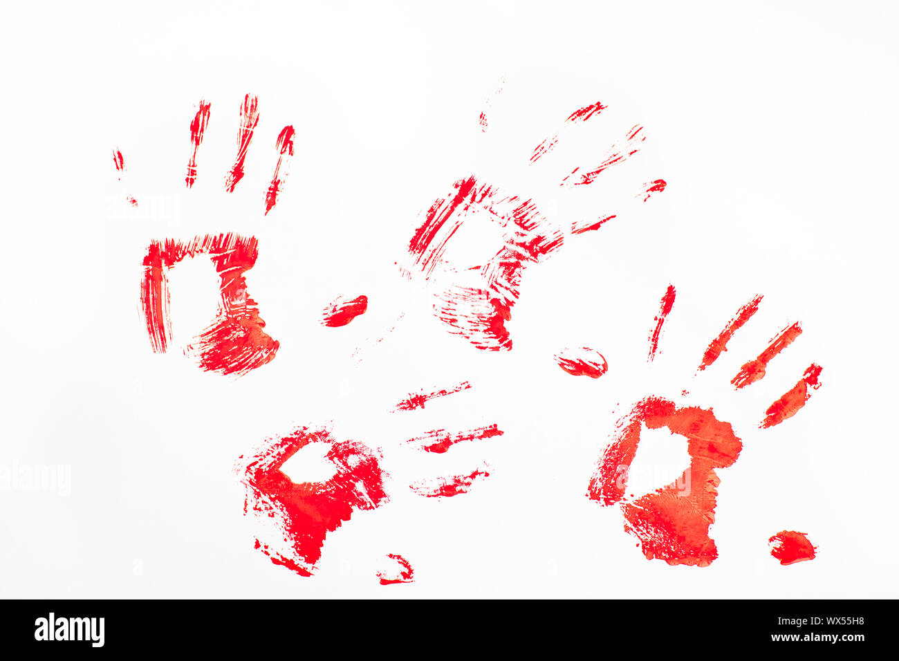 Four red handprints against a white background Stock Photo - Alamy