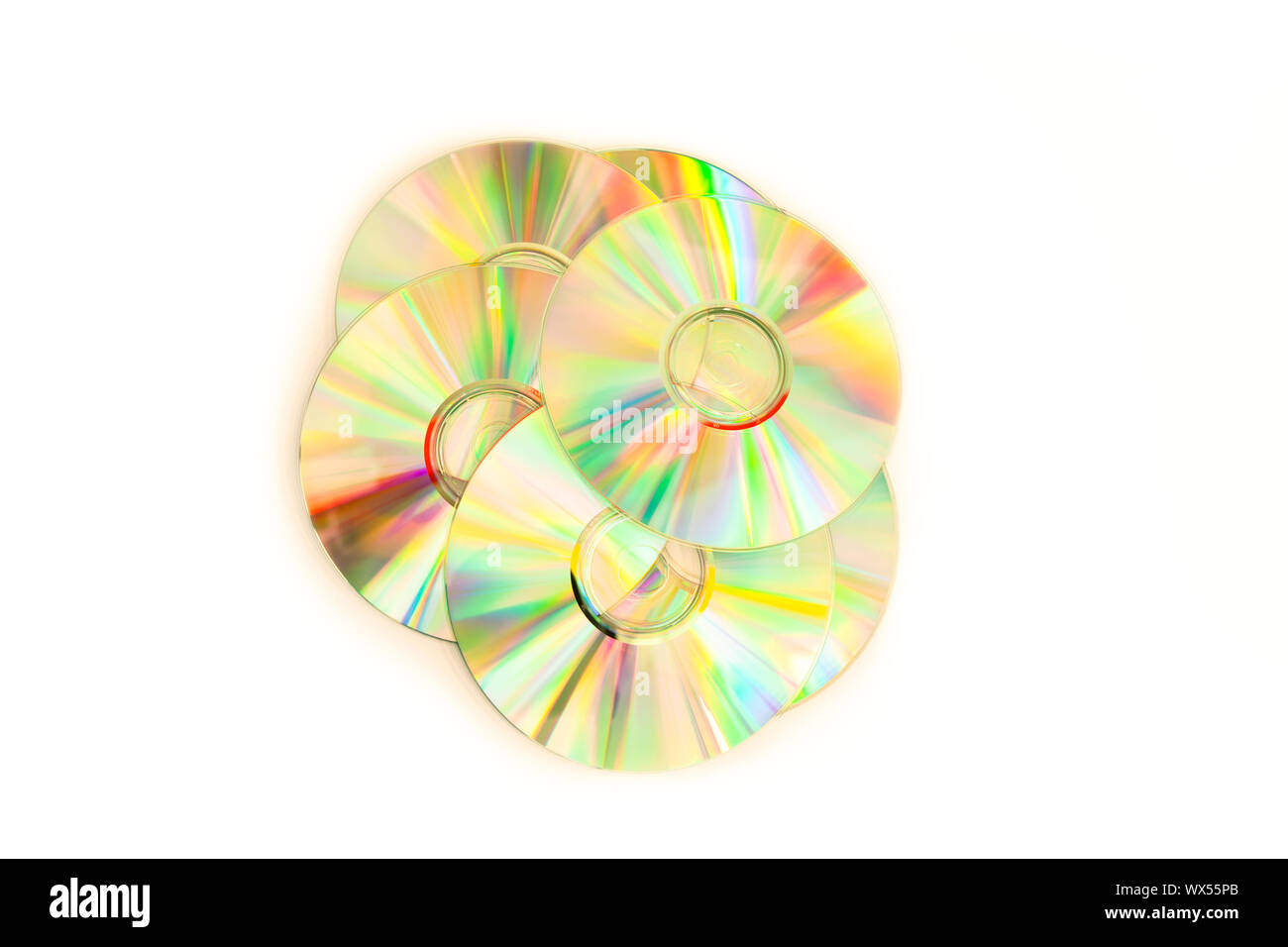 Cd-rom piled up against a white background Stock Photo - Alamy