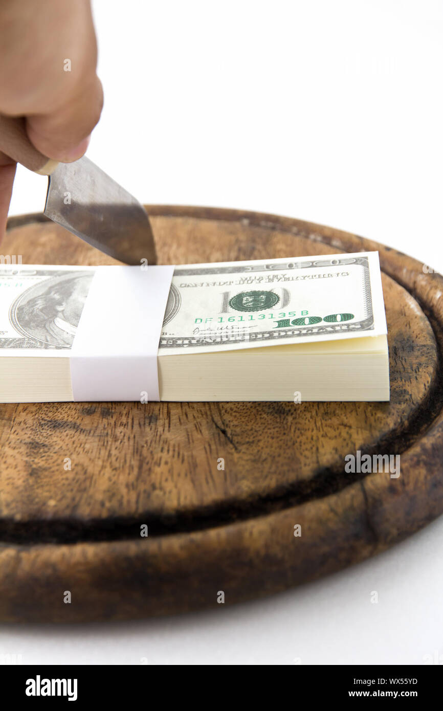 dollar on chopping block Stock Photo - Alamy