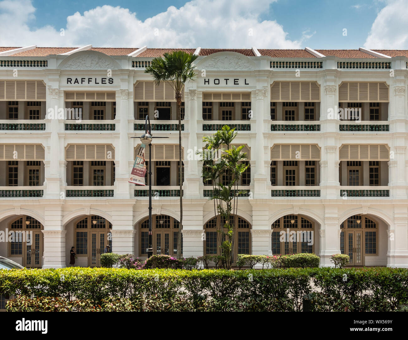 Singapore - March 20, 2019: Beige facade of red roofed Raffles Hotel ...