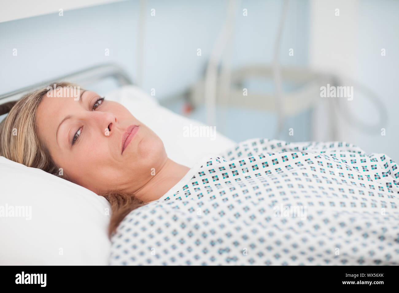 Female patient looking at camera in hospital ward Stock Photo - Alamy