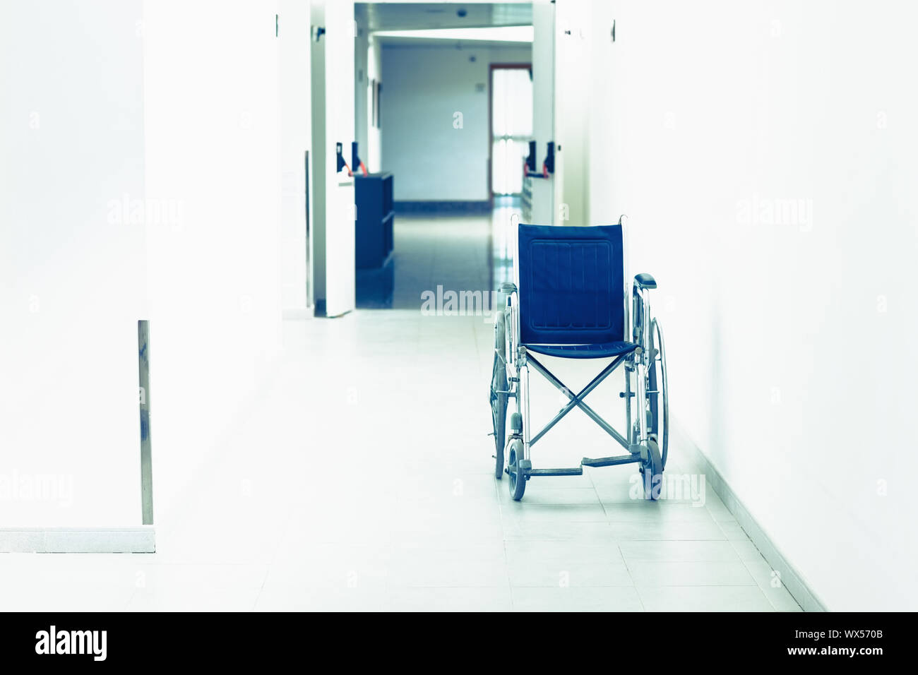 Wheelchair in the corridor in hospital ward Stock Photo - Alamy