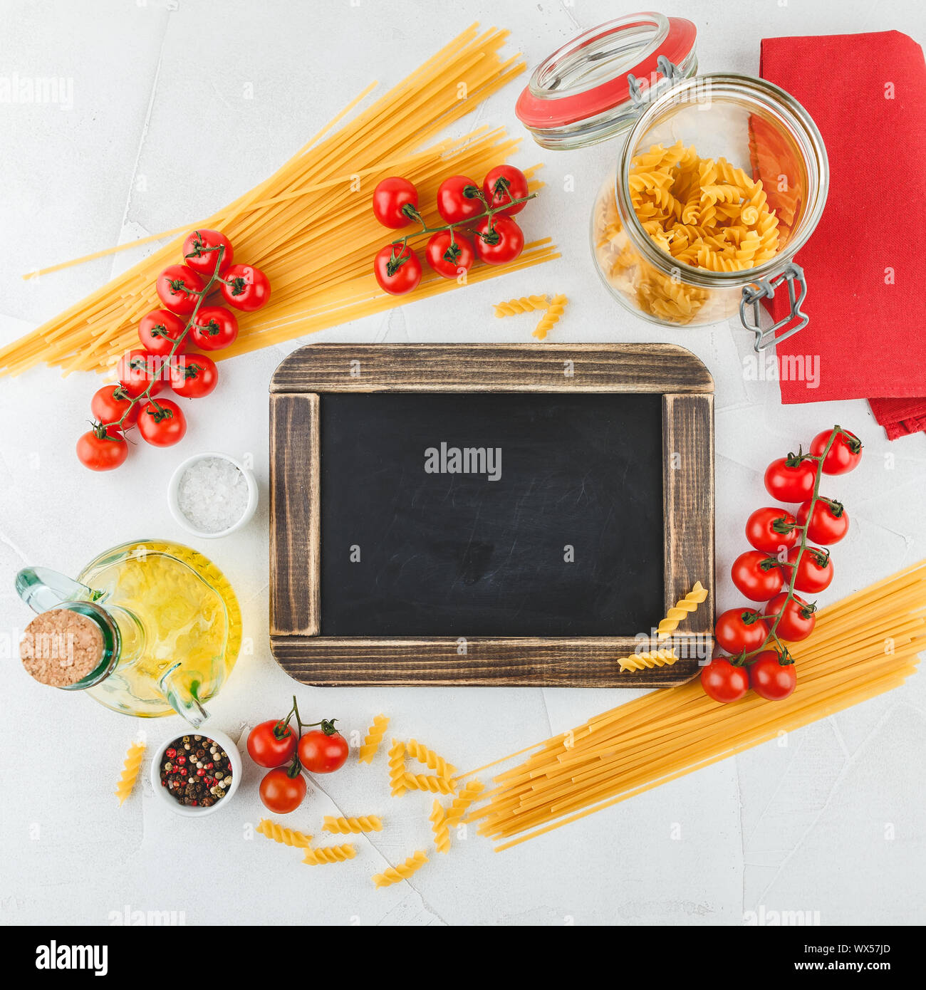 Chalk board with copy space with Ingredients for cooking Italian pasta ...