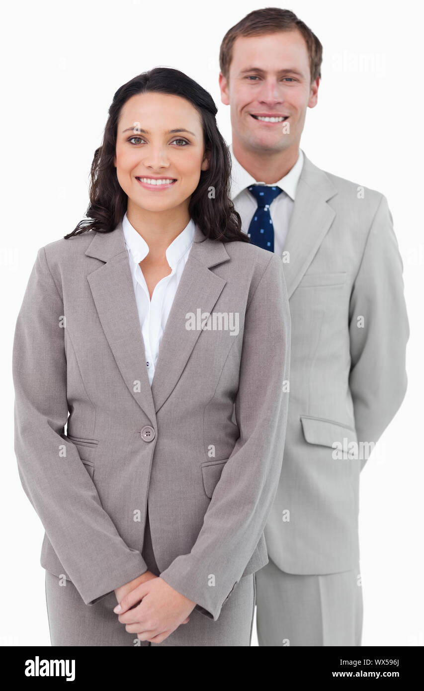 Smiling office staff standing together against a white background Stock ...