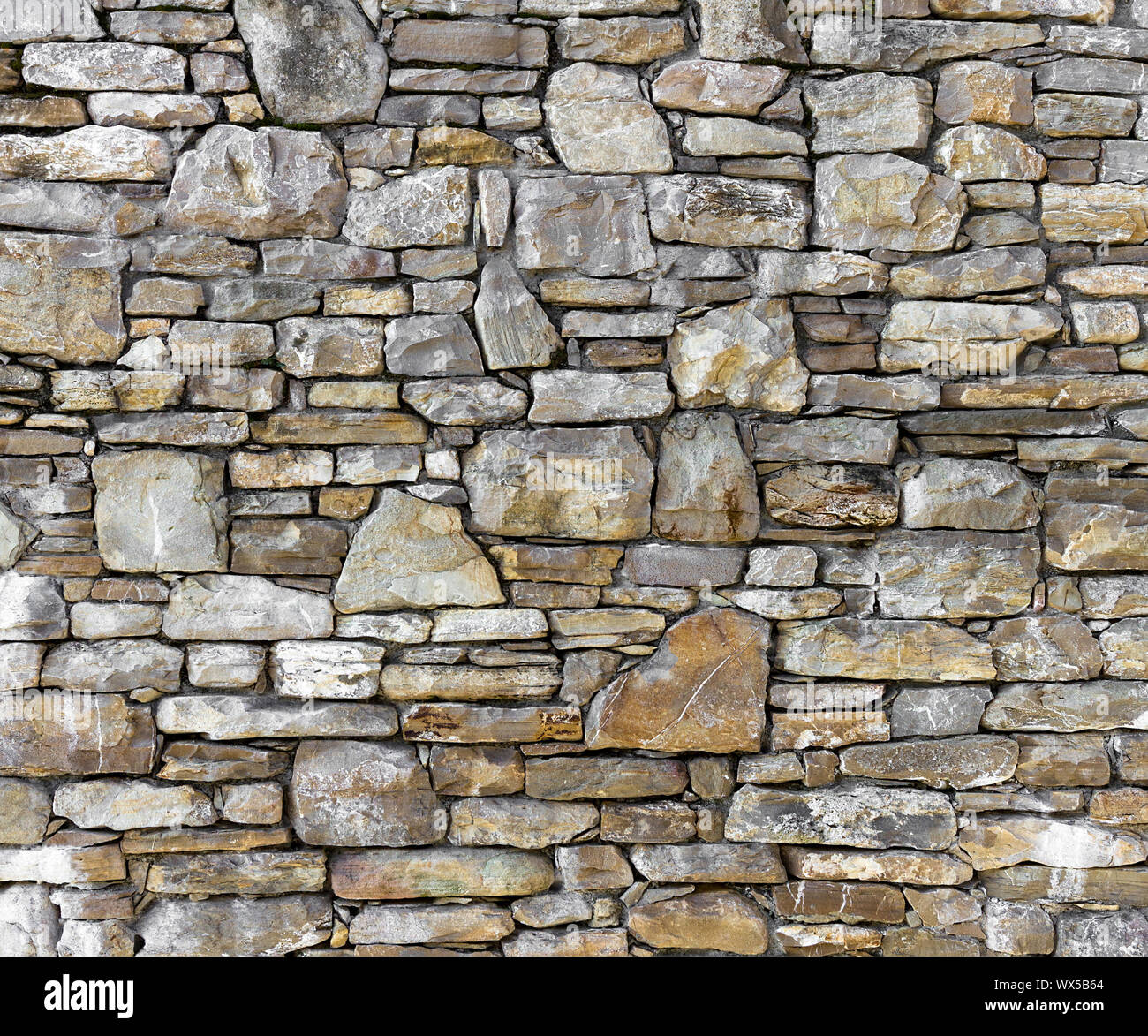 Rustic stone wall Stock Photo - Alamy
